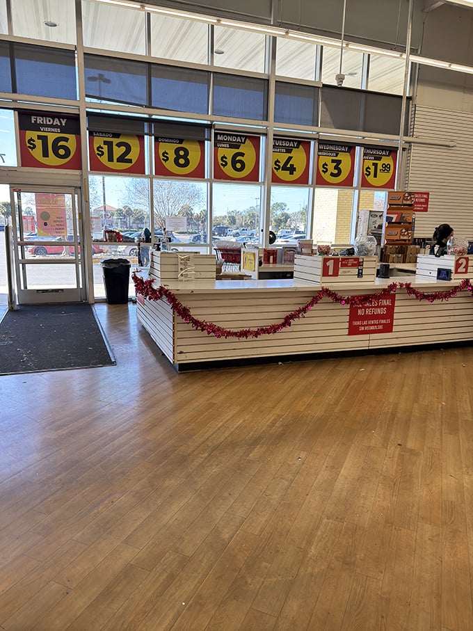 The checkout counter—the final frontier between you and victory. That sign says there's a card fee, but the savings make it worthwhile.