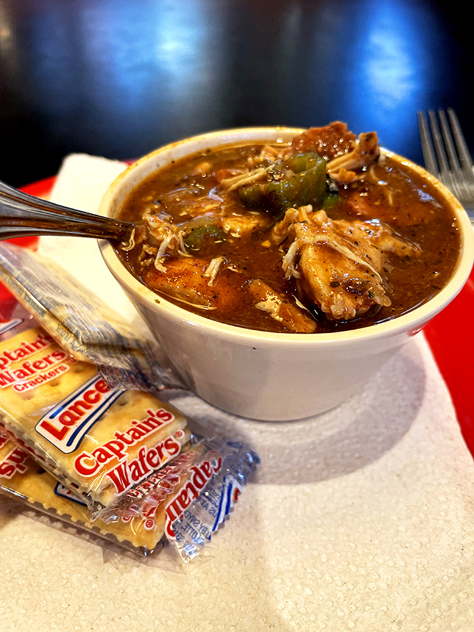 This isn't just soup—it's a spicy, smoky gumbo where pulled pork swims happily with vegetables in a rich, dark roux sea.
