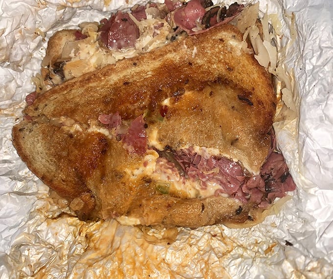 The Reuben doesn't mess around—tender corned beef, Swiss cheese, and sauerkraut melded together in harmonious sandwich unity.