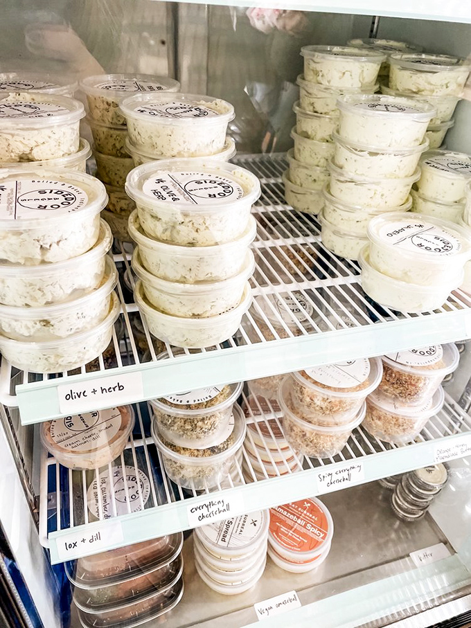 The schmear case—a dairy dreamscape of possibilities. From classic plain to adventurous herb blends, each container holds spreadable joy.