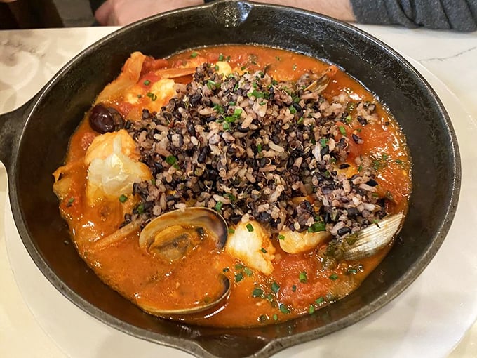 Seafood stew that rivals coastal offerings – a rich tomato broth cradles clams, shrimp and fish beneath a crown of nutty wild rice. 