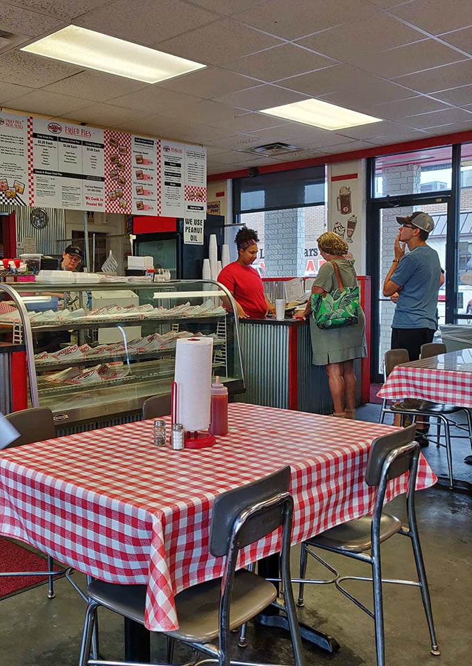 The front line of flavor – where pie dreams become reality. These folks aren't just staff; they're happiness facilitators in action.