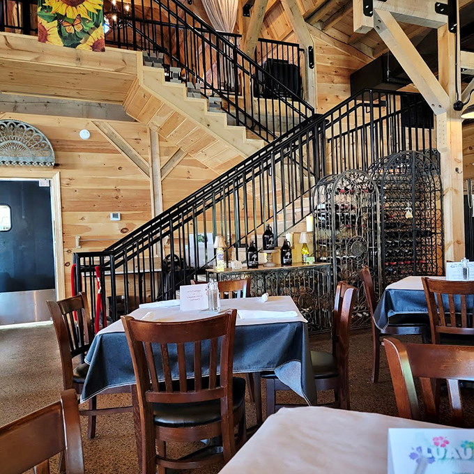 That staircase leads to more seating, but the real elevation happens on your plate. Notice the wine storage—priorities in order!