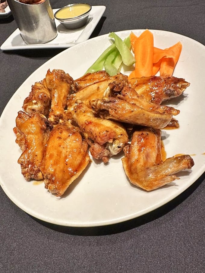 Wings that didn't skip gym day—meaty, glistening with sauce, and arranged with the confidence of food that knows it's about to disappear.