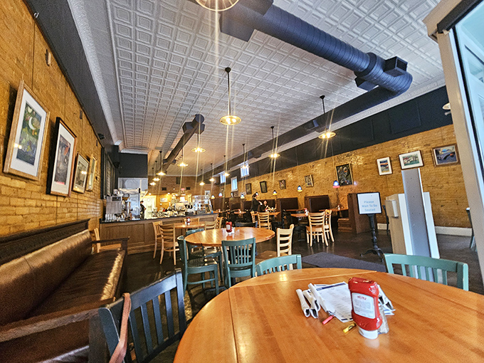 Exposed brick, pressed tin ceilings, and comfortable booths—The Bluebird's interior feels like the Kentucky hug you didn't know you needed.