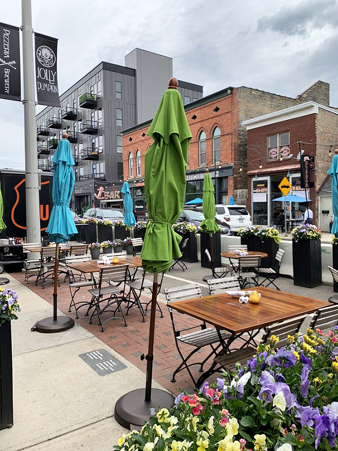 Outdoor seating that captures Grand Rapids' evolving urban landscape. Those colorful umbrellas aren't just for shade—they're neighborhood beacons.