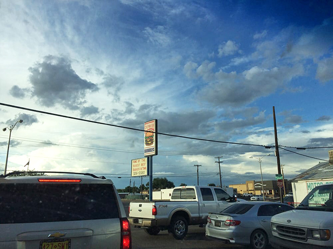 The parking lot at sunset—where hungry pilgrims gather for their burger benediction under New Mexico's dramatic skies.