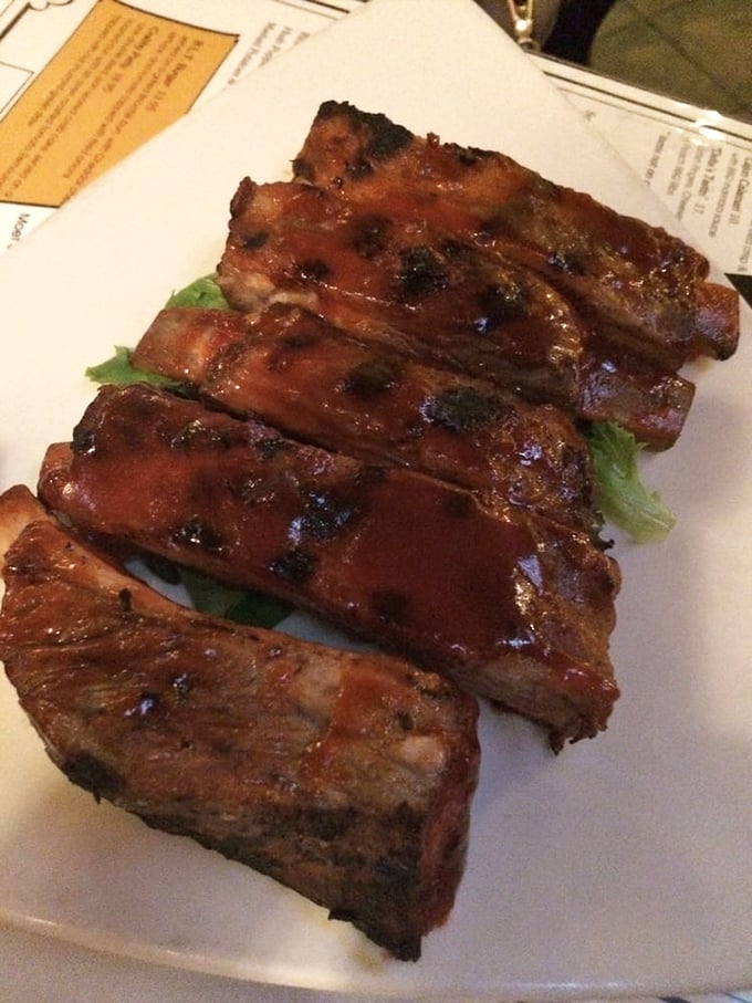 These ribs don't just fall off the bone—they practically jump onto your fork in a delicious surrender.