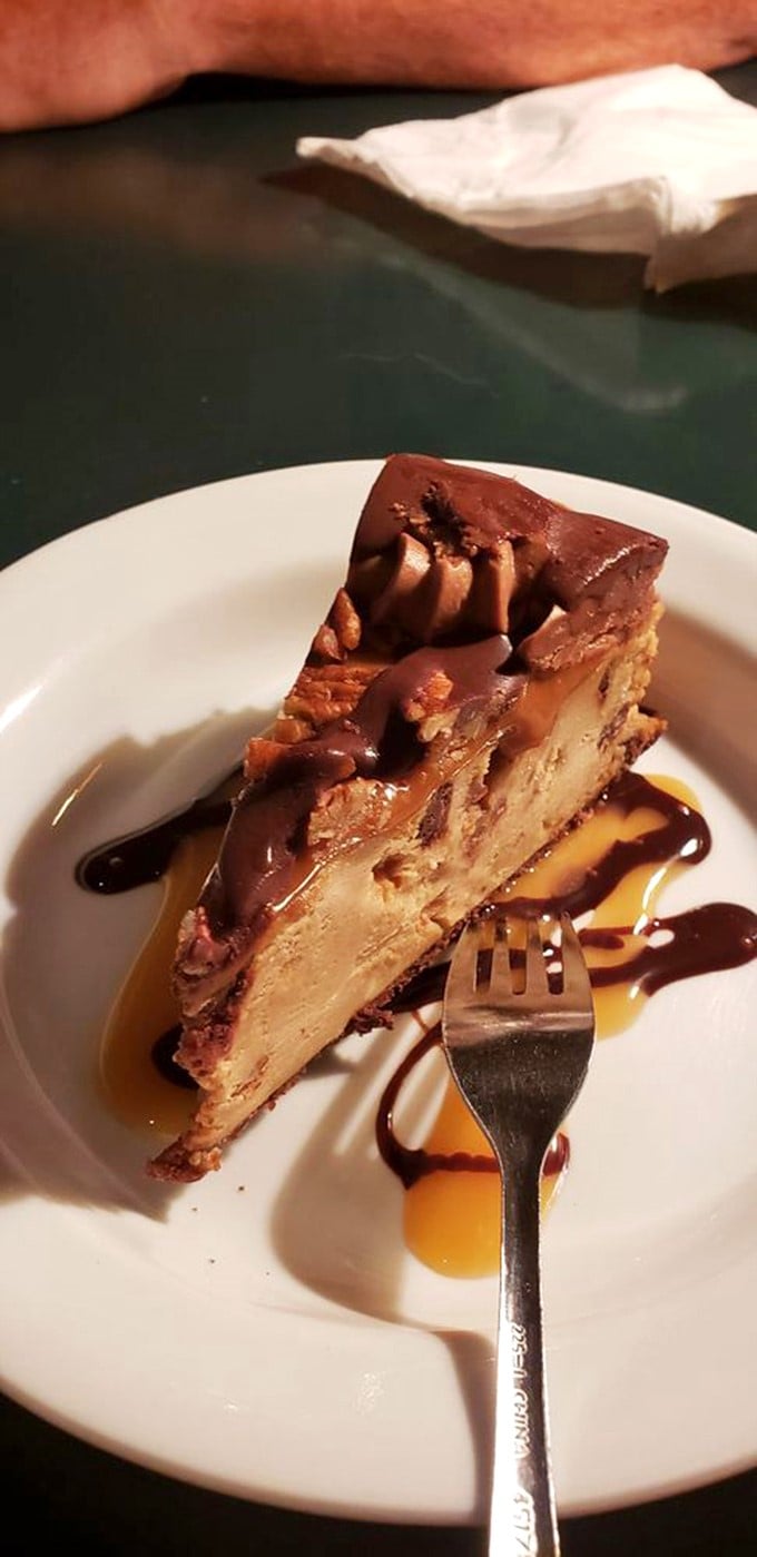 Not merely cheesecake, but an engineering marvel of chocolate, caramel, and creamy filling that makes sharing seem like a fundamentally flawed concept.