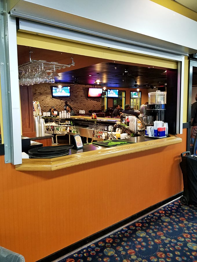 The bar window—where liquid courage is dispensed to bowlers before they attempt that impossible 7-10 split for the third time.