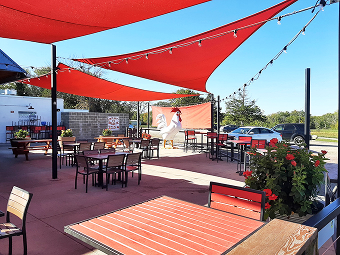 The outdoor patio with those striking red shade sails isn't just a place to eat—it's where summer memories are made, one crispy bite at a time.