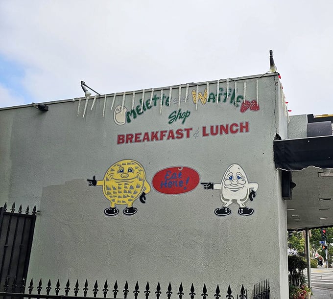 The exterior mural tells you everything you need to know: anthropomorphic breakfast foods with personality. They're not just cute—they're prophetic.