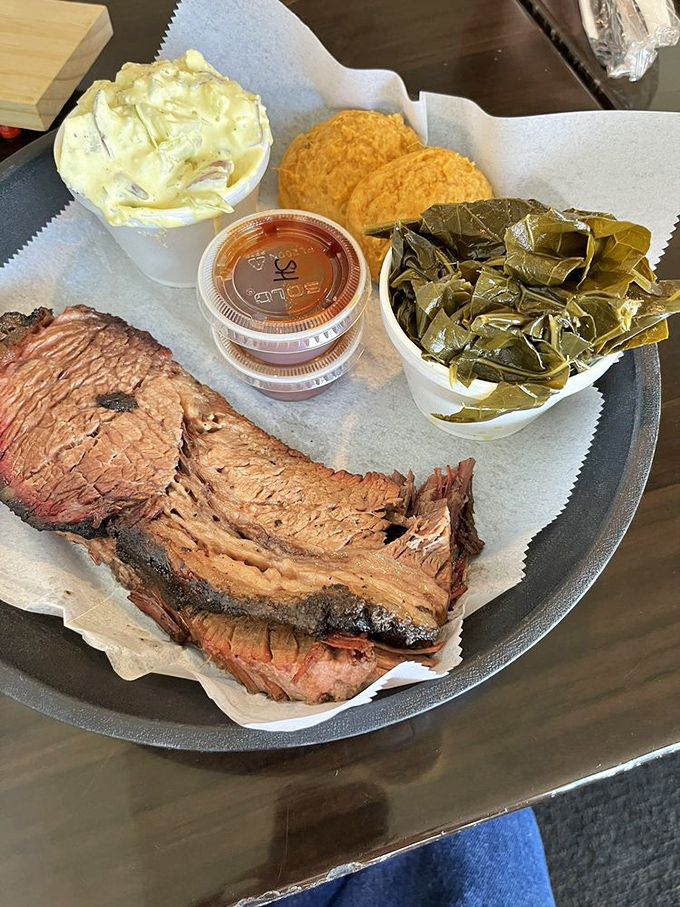 A brisket plate that makes vegetarians question their life choices. That bark, that smoke ring, that tenderness—it's the holy trinity of BBQ perfection.