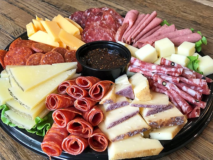 This charcuterie board isn't just food—it's a color wheel of cured meat artistry that makes ordinary lunch meat hide in shame.