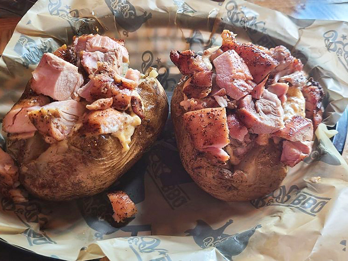 The stuffed potato—where barbecue innovation meets classic comfort. A starch vessel transformed into a delivery system for smoky chicken glory.
