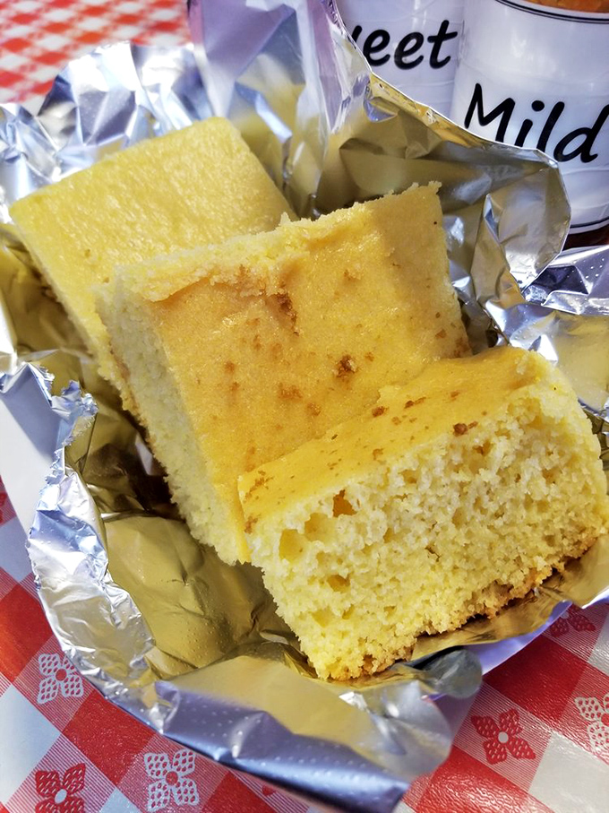 This cornbread isn't just a side—it's the golden co-star of the meal, managing to be both cakey and crumbly in that perfect Southern sweet spot.