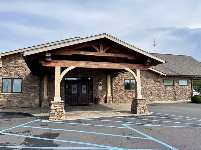 No flashy signs needed—just solid stone, sturdy timber, and the quiet confidence of a restaurant that lets its reputation do the talking.