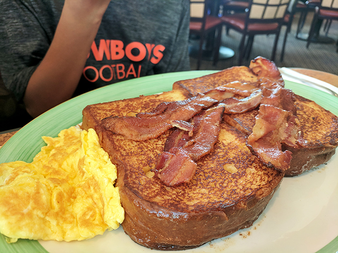 French toast this perfect deserves its own national holiday, with bacon strips that have achieved that magical balance between crispy and chewy that bacon aficionados dream about.