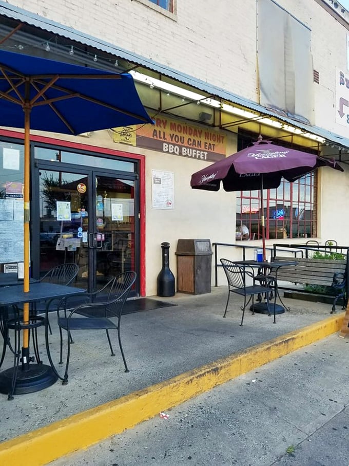 The outdoor seating area – where the smell of smoke mingles with fresh air, and sauce-stained shirts are badges of honor.