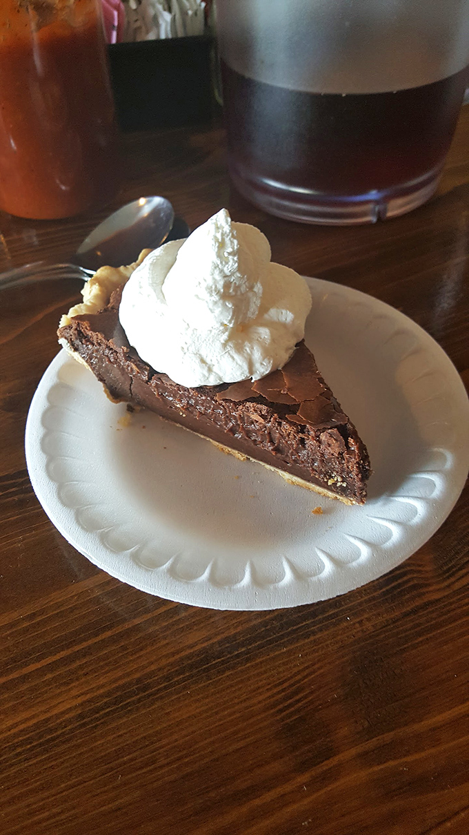 After a barbecue feast, somehow there's always room for pie. This chocolate slice with whipped cream proves dessert isn't just an option—it's a responsibility.