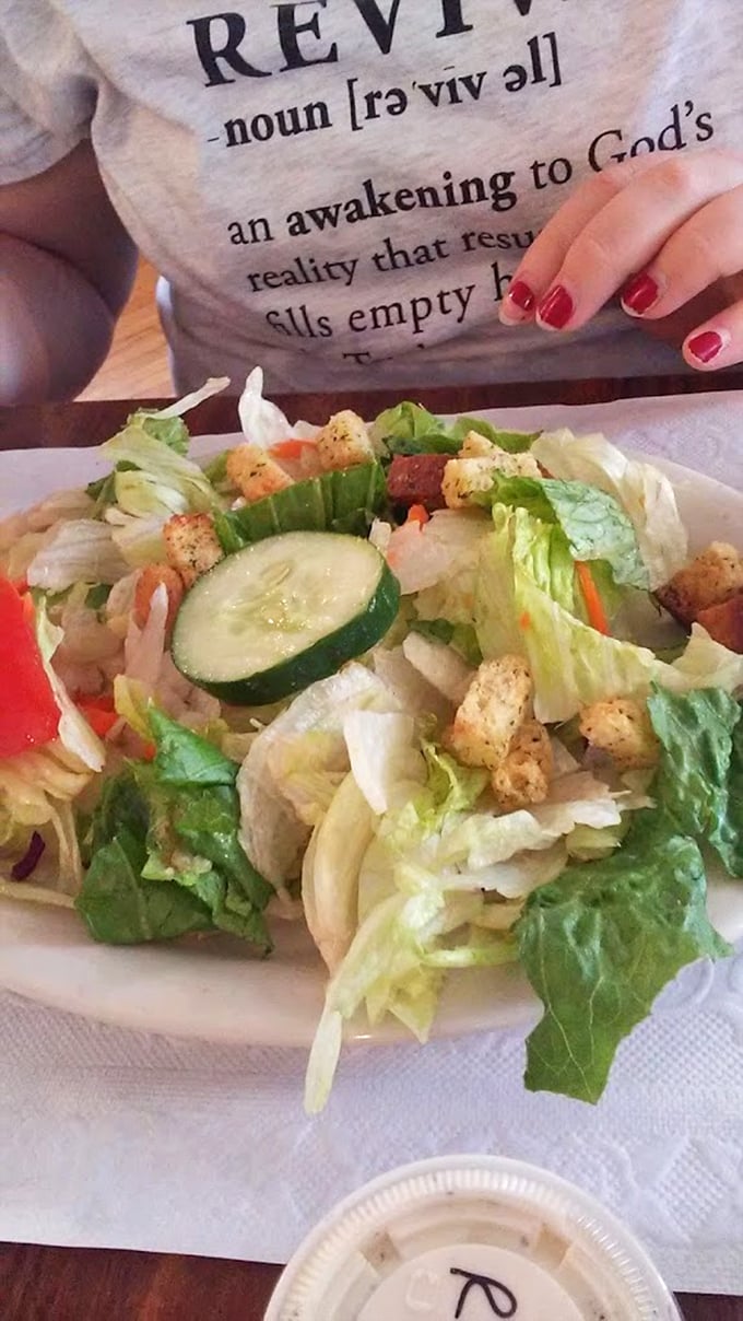 A house salad that doesn't apologize for being exactly what it claims to be – fresh, honest, and ready to balance out that pie you're eyeing.