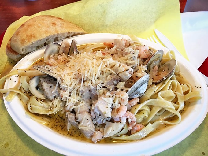 Inside Tony's, where the locals and tourists unite in the universal language of "mmm" and "pass the napkins, please." 