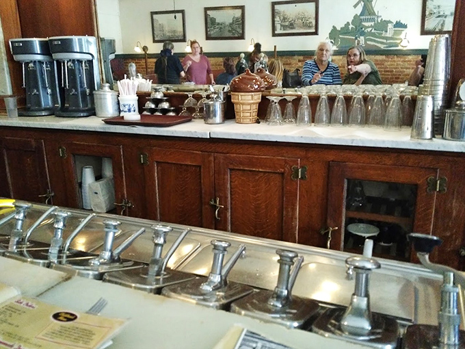 The soda fountain counter—a relic of Americana that still works its magic, promising fizzy concoctions that taste better simply because they're made the old-fashioned way.
