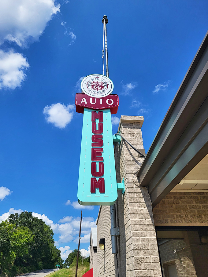 The museum's colorful neon sign reaches skyward, a modern tribute to the classic roadside attractions that once lined the Mother Road.