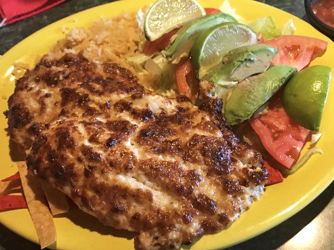 This mesquite-grilled fish, topped with fresh avocado and served with bright lime wedges, proves Sabroso's talents extend beyond enchiladas.