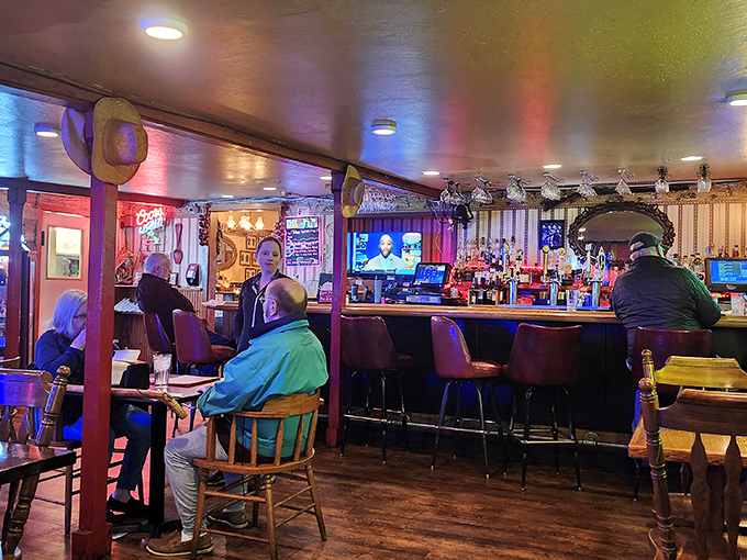 The bar area—where strangers become friends over drinks, sports on TV, and the shared understanding that calories don't count when you're having this much fun.