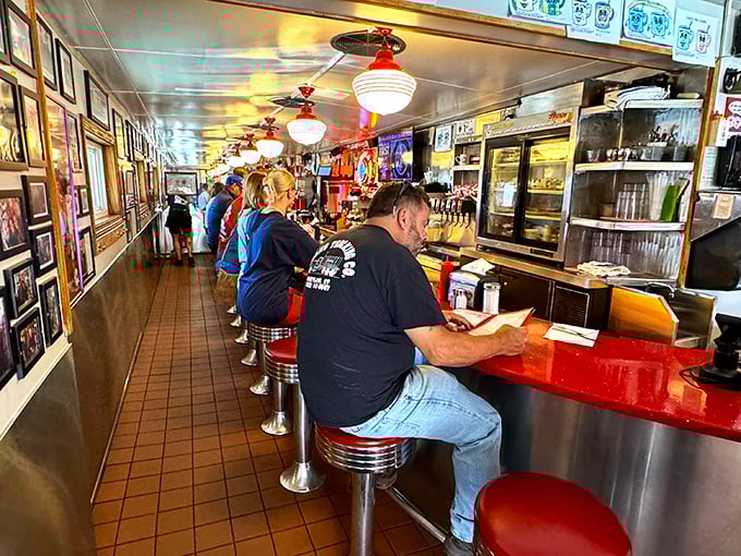 The narrow galley design isn't just practical—it's social engineering that ensures everyone feels part of the same delicious conversation.