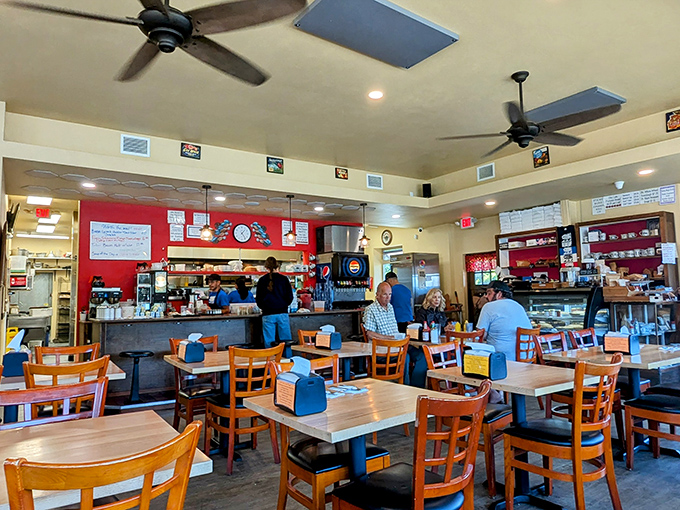 Inside Otis Café, strangers become friends united by anticipation of good food. The red wall behind the counter adds warmth matched only by the service.