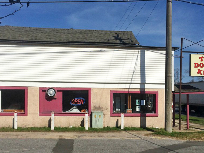 Morning sunshine illuminates the promise of sweetness within. That "OPEN" sign might as well say "HAPPINESS SERVED HERE."