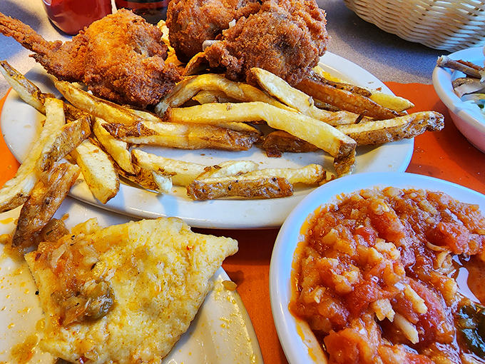 The full Barberton experience – where chicken, eggs, and hot sauce create a holy trinity of flavor that's been converting food pilgrims since 1933.