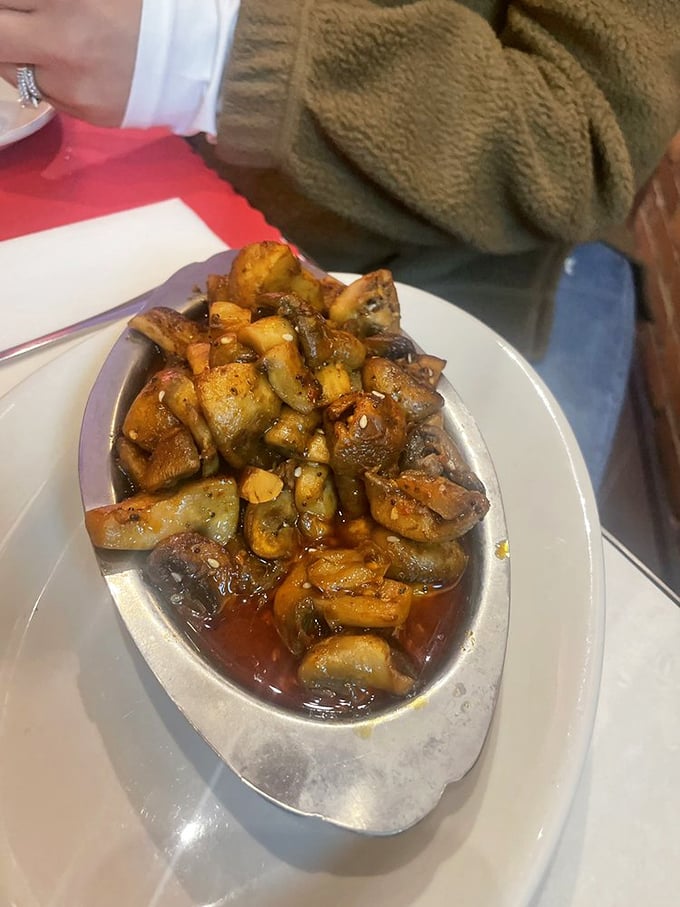 These mushrooms aren't just sautéed—they're transformed. Swimming in their savory bath, they've found their true calling in life. 