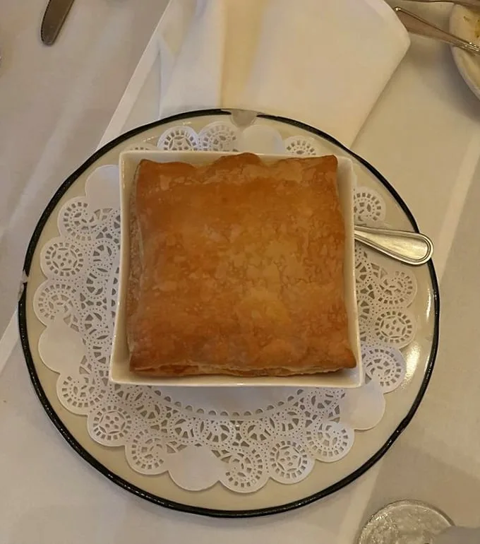 Beneath this golden pastry fortress lies a savory kingdom waiting to be discovered—comfort food elevated to an art form.