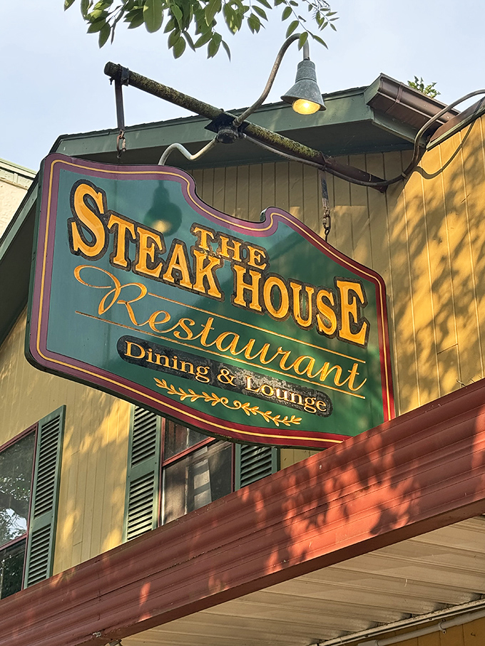 The iconic green and gold sign stands as a promise of good things to come—a prelude to the meaty symphony waiting inside.