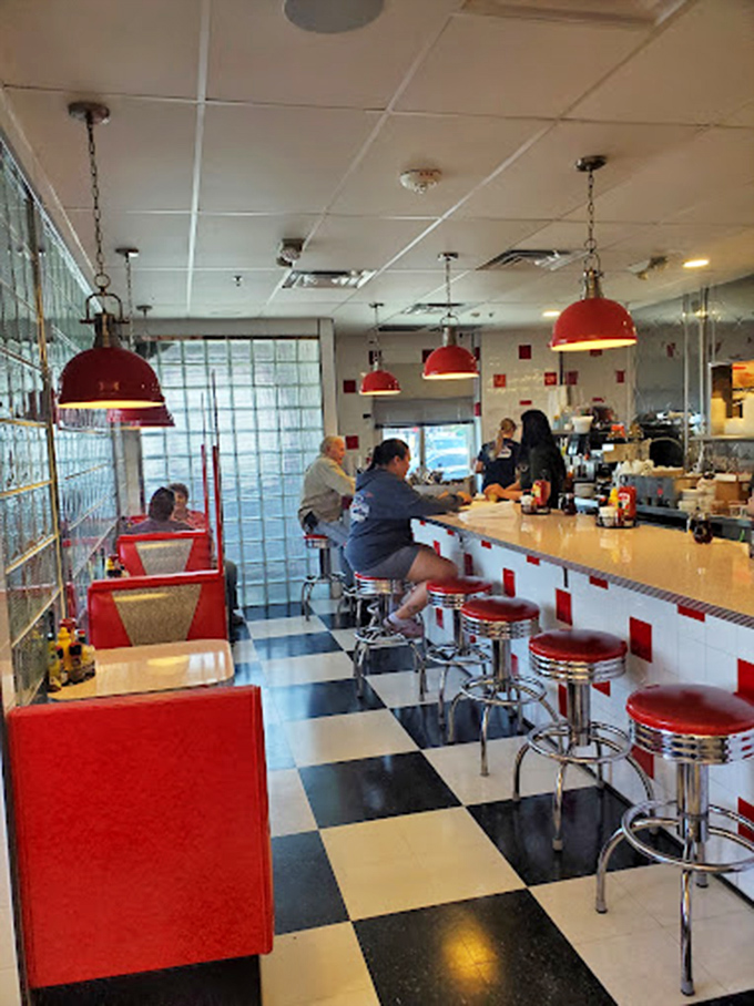 The counter experience—where you can watch culinary choreography up close while perched on those iconic spinning stools that make everyone feel like a kid.