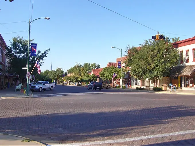 Lindsborg's brick-paved Main Street – where Swedish charm meets Kansas hospitality. Those American flags add just the right patriotic touch!