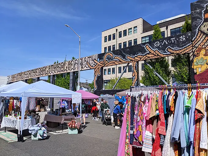 Treasure hunting under artistic skies! This colorful market transforms an ordinary street into a vintage lover's paradise.