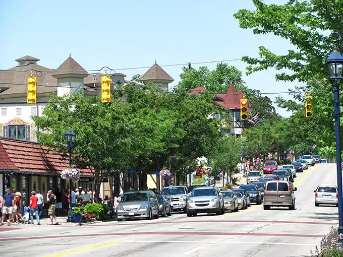 Main Street Frankenmuth blooms with hanging flower baskets in summer. Like stepping into a European fairy tale with better parking options.