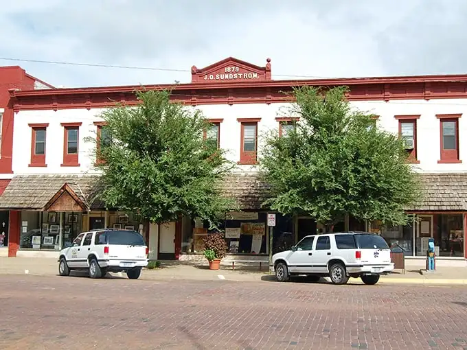 The historic J.O. Sundstrom building stands proud since 1879. Red brick never looked so inviting against that clear Kansas sky!