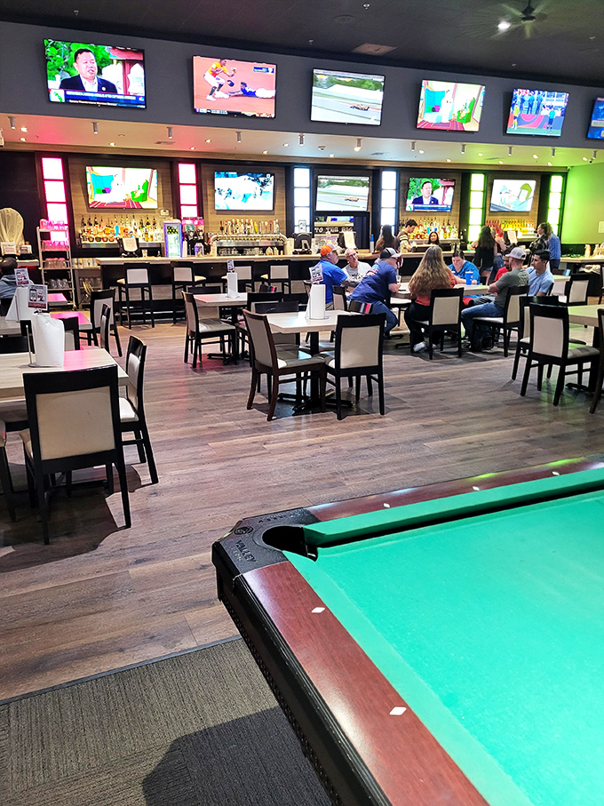 Where leisure meets libation—this modern dining area offers a perfect perch for parents while kids play nearby. Strategic relaxation station!