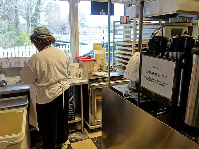 Where the magic happens: Dedicated hands crafting biscuit perfection in a kitchen that's been turning out Southern breakfast bliss since 1978.