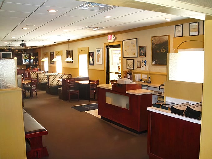 Step inside and you're transported to a golden-hued dining room where the hostess station isn't just furniture—it's the gateway to carnivorous bliss.
