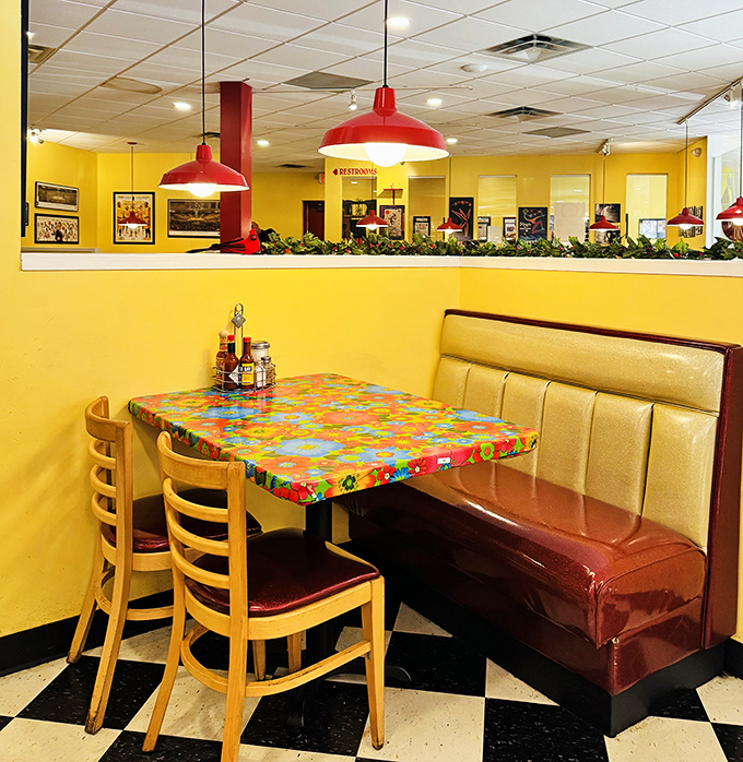 Sunshine-yellow walls and colorful tables create a cheerful backdrop for serious eating. This isn't just a meal—it's a mood elevator.