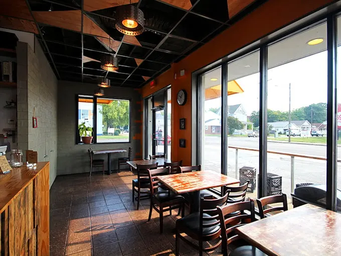 Simplicity reigns supreme inside, where wooden tables and industrial lighting create the perfect stage for biscuit brilliance.