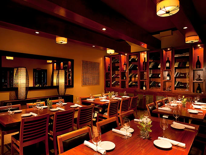 Wine racks and warm wood tones create the perfect backdrop for carnivorous adventures. It's like your wealthy uncle's den, if he were obsessed with perfect dining.