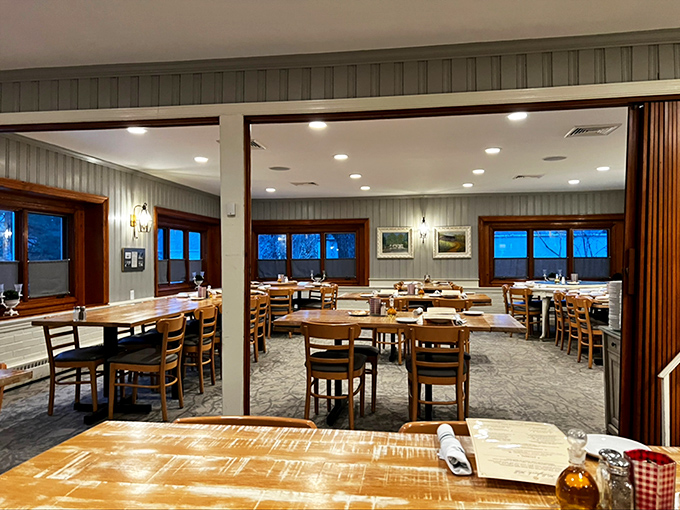 Wooden tables, warm lighting, and proper place settings—dining rooms like this remind us when meals were events, not just refueling stops.