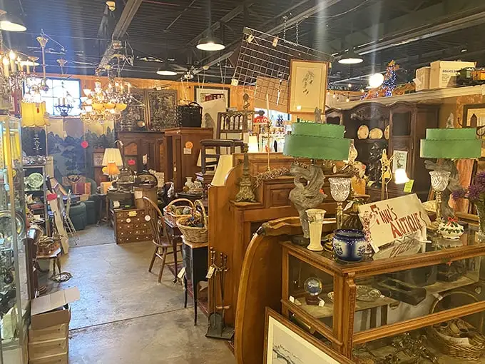Organized chaos at its finest. This booth resembles your eccentric aunt's living room—if she collected everything from vintage textiles to mysterious curios.